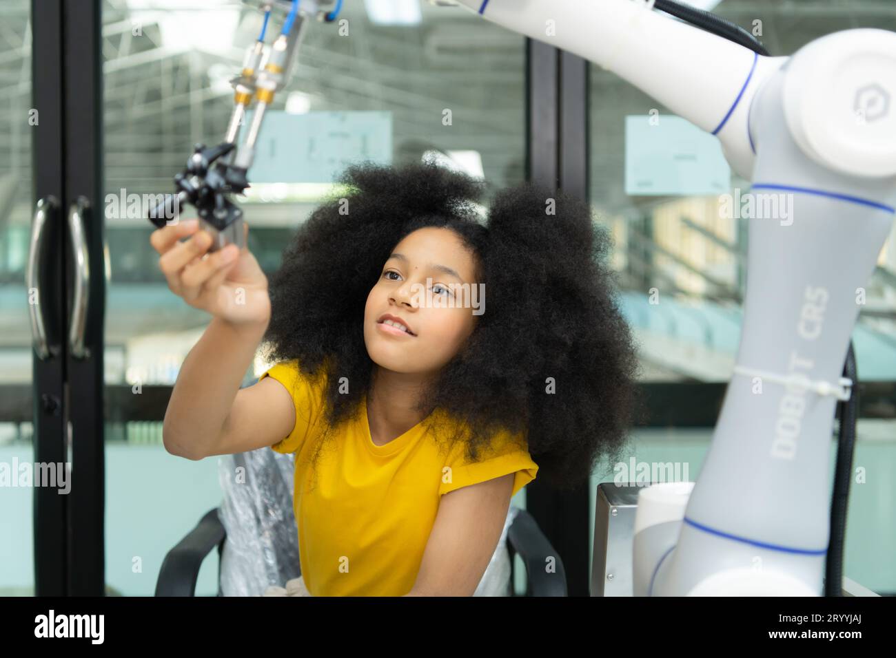 Children using the hand robot technology, Students are studying ...