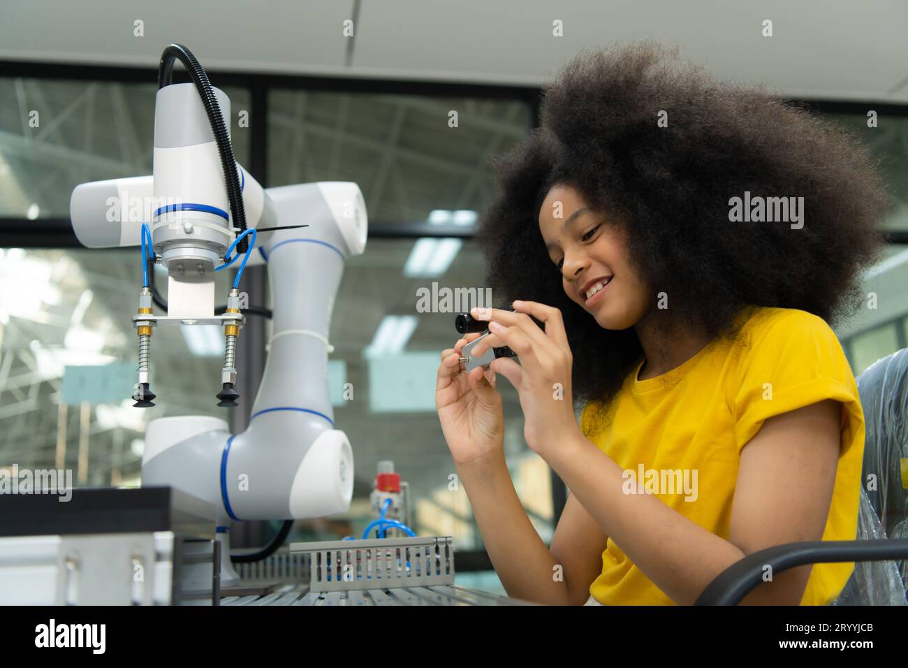 Children using the hand robot technology, Students are studying ...