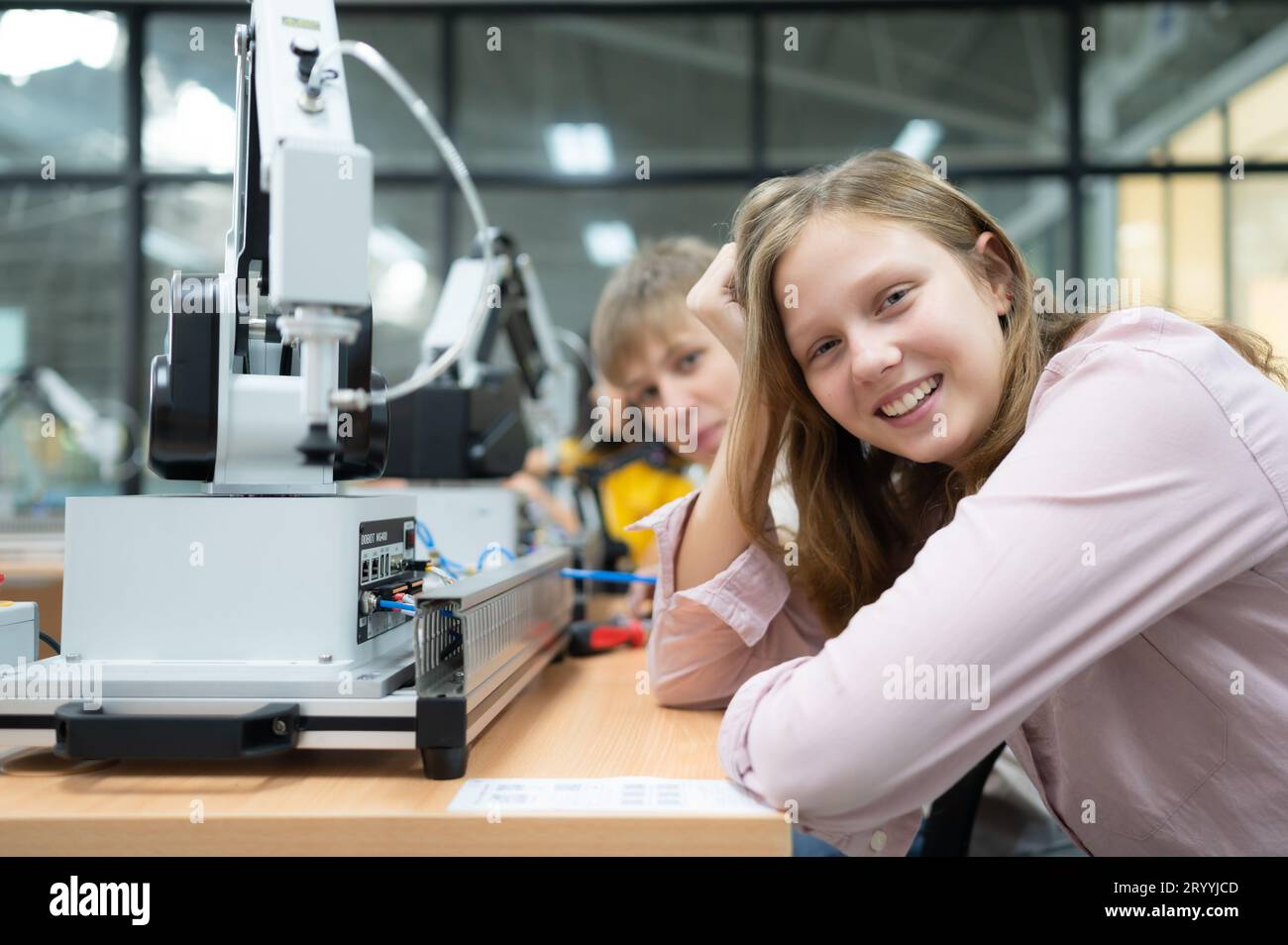 Children using the hand robot technology, Students are studying ...