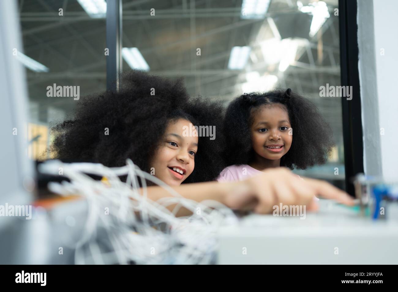 Children using the hand robot technology and having fun Learning the ...