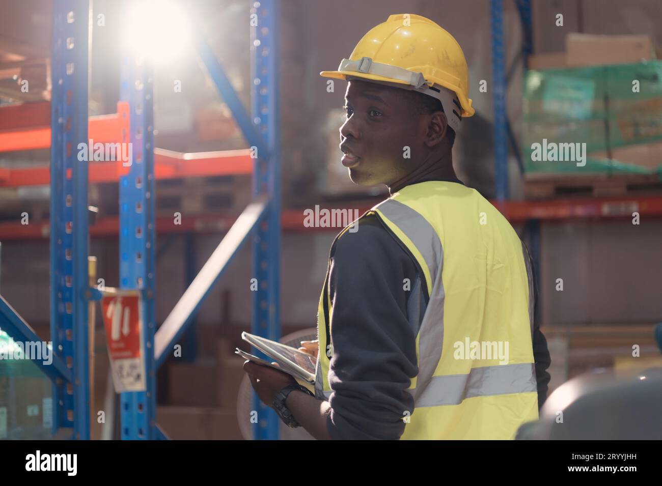 Portrait of warehouse workers in a large warehouse with their own ...
