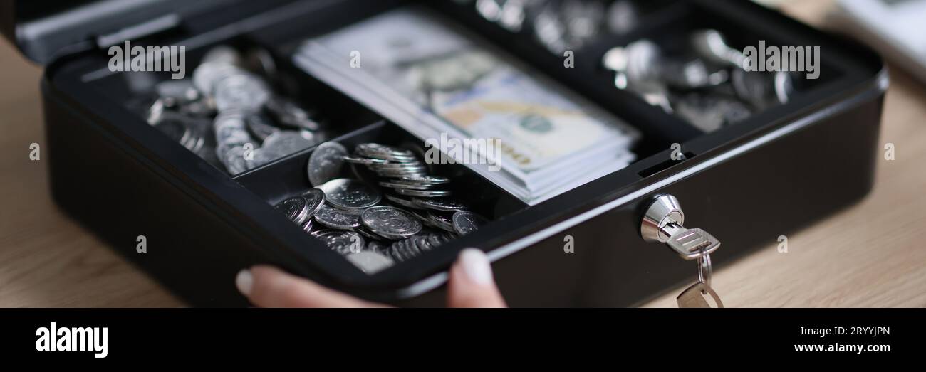 Big cash register of accountant with safety lock and key Stock Photo ...