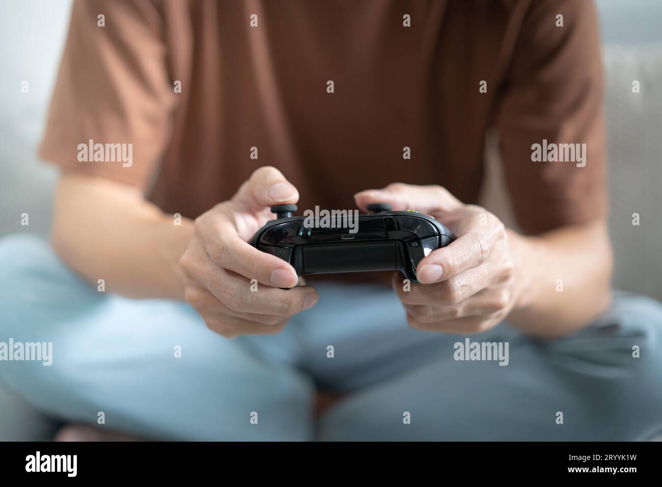 Young Asian man gamer controller video console playingÂ holding hobby ...