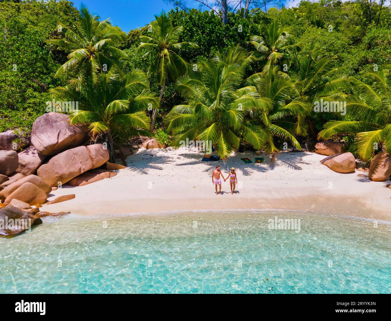 Anse Lazio Praslin Seychelles, young couple men and woman on a tropical ...