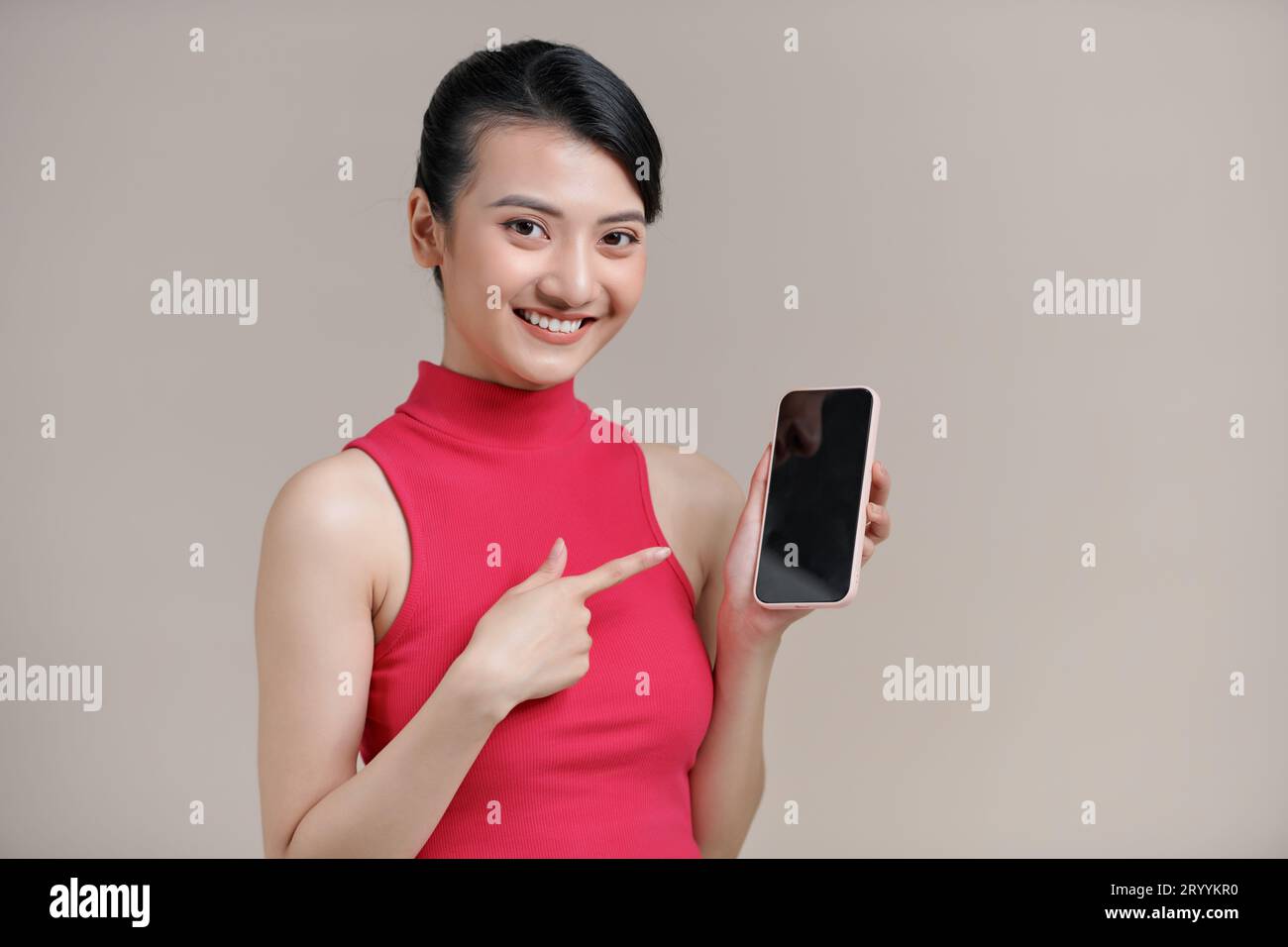 The beautiful Asian woman pointed at the phone with her finger Stock ...