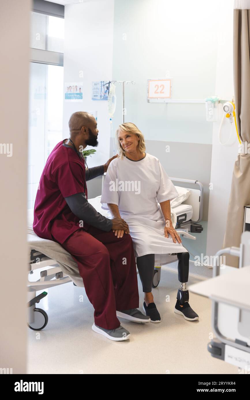 Senior caucasian female patient with prosthetic leg and african ...
