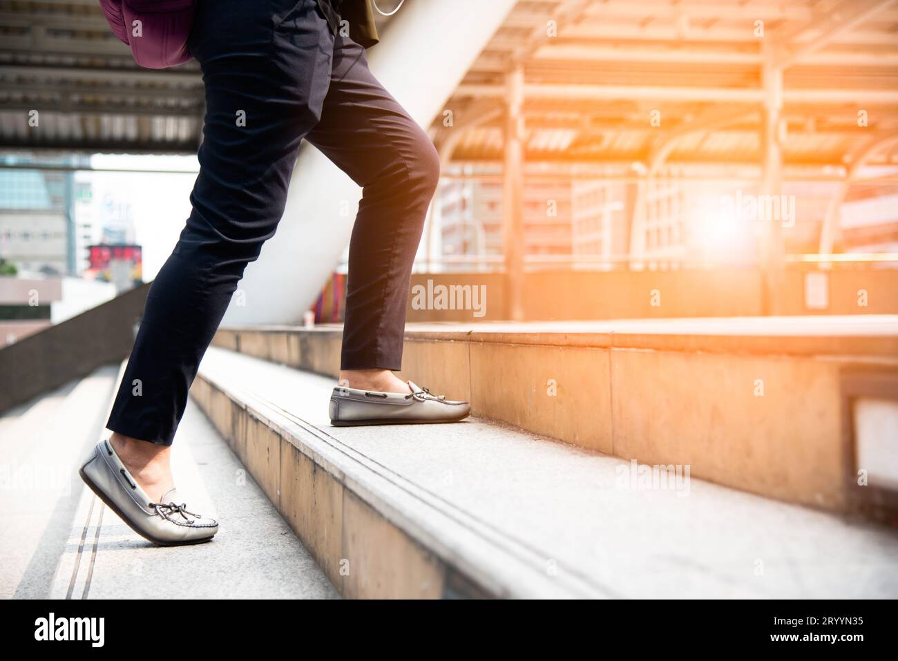 Close up of woman legs walking up stair in the city. Business and ...
