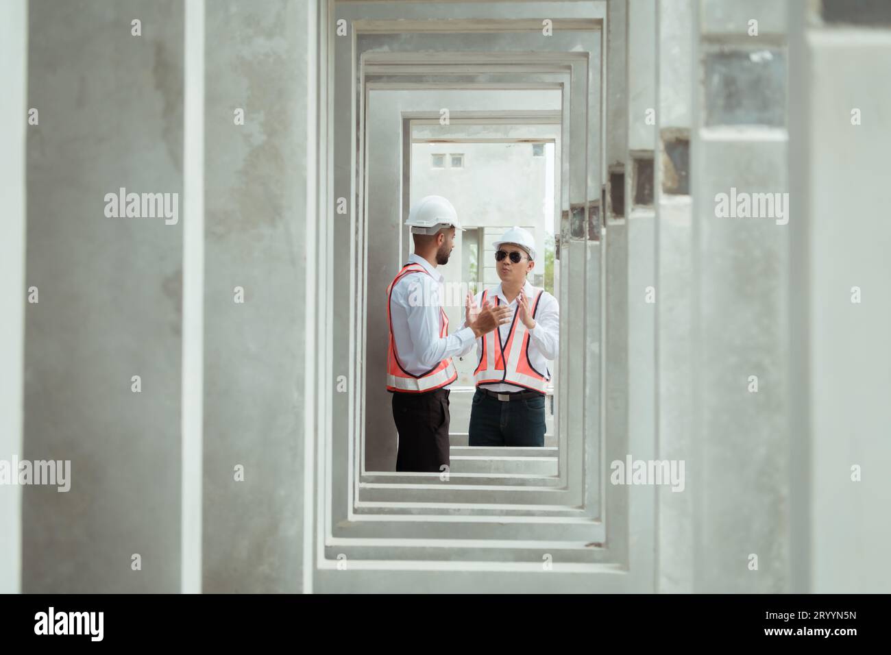 Both of construction engineers verify the constructed precast concrete ...