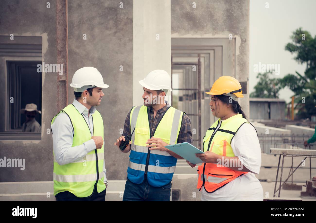 Group of architects, construction foremen, and construction engineers ...