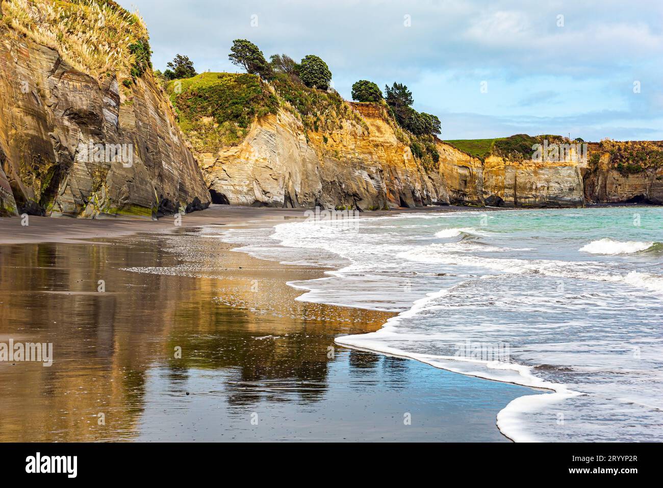 Thin layer of water on sand Stock Photo - Alamy