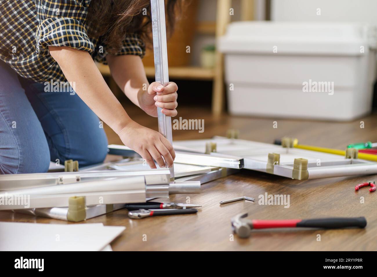 Asian Woman self repairs furniture renovation using equipment to diy ...