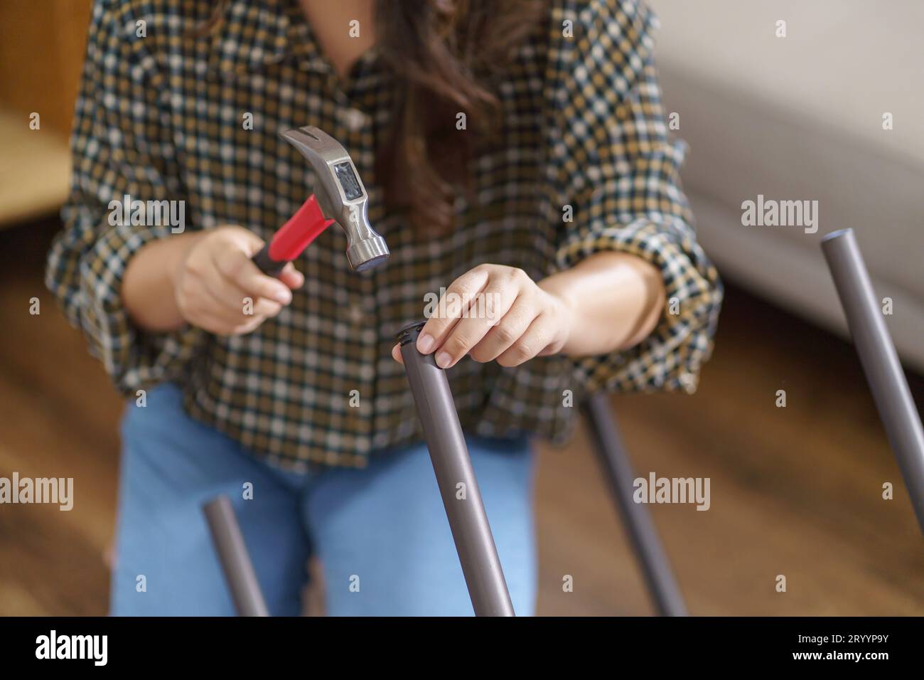 Asian Woman self repairs furniture renovation using equipment to diy ...