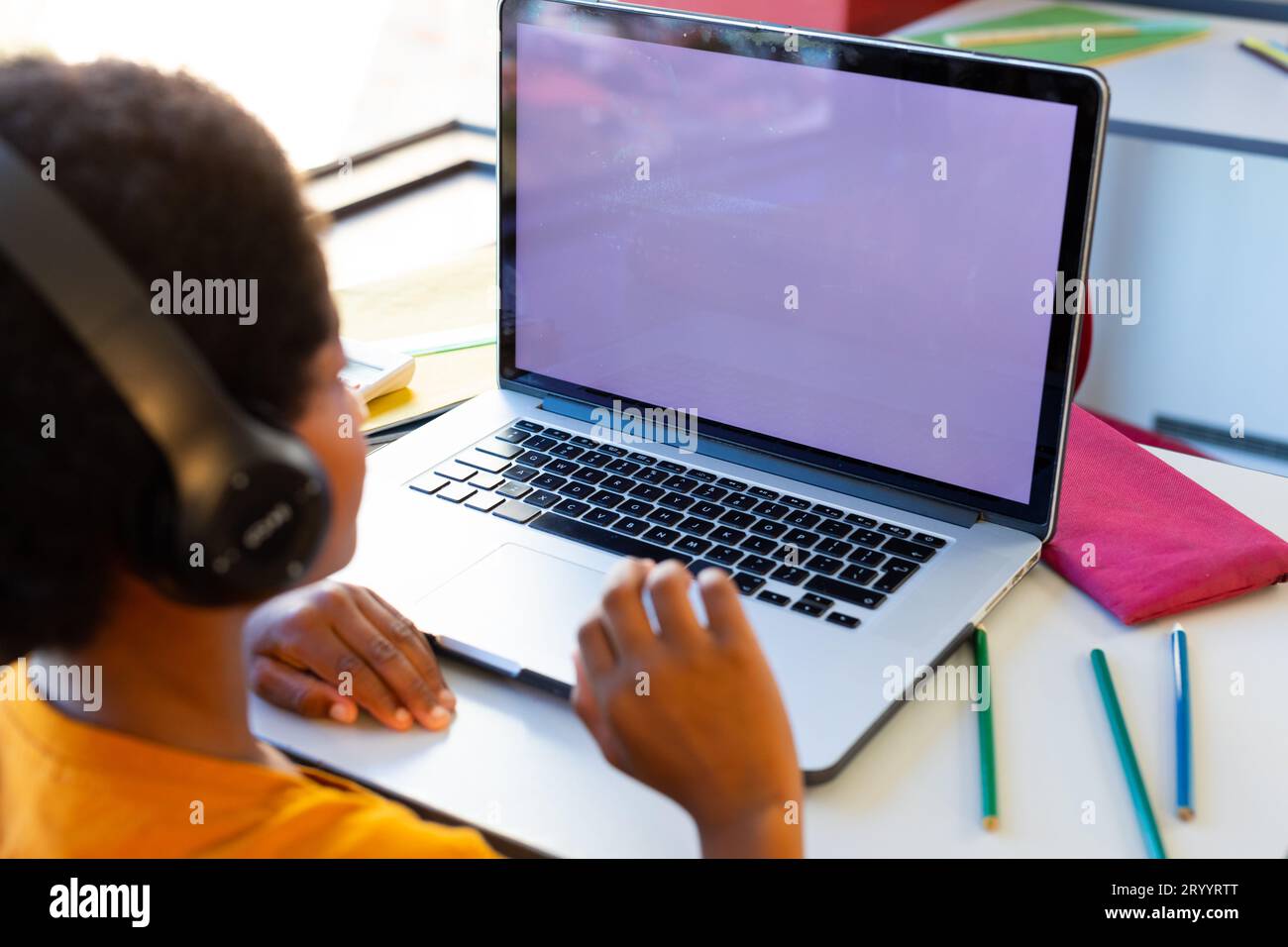 School kid using headphone classroom hi-res stock photography and ...