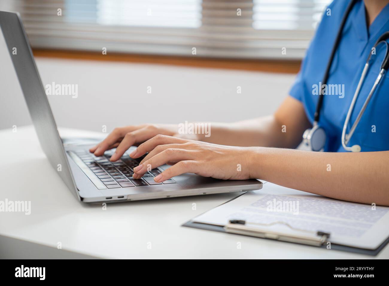 Medical technology network team meeting concept. doctor hands typing on ...