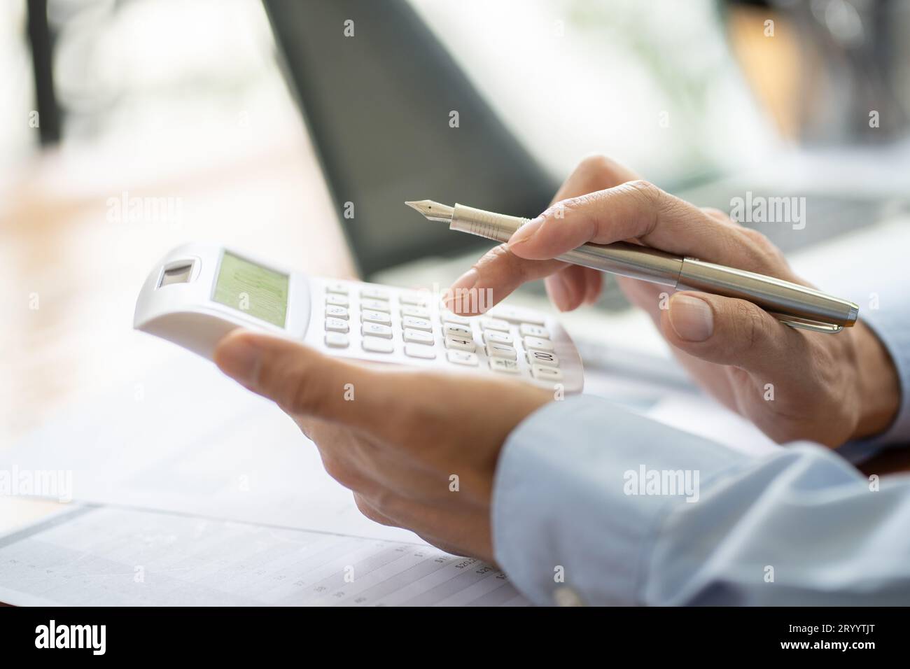 Businessman Accountant analyzing investment charts Invoice and pressing ...