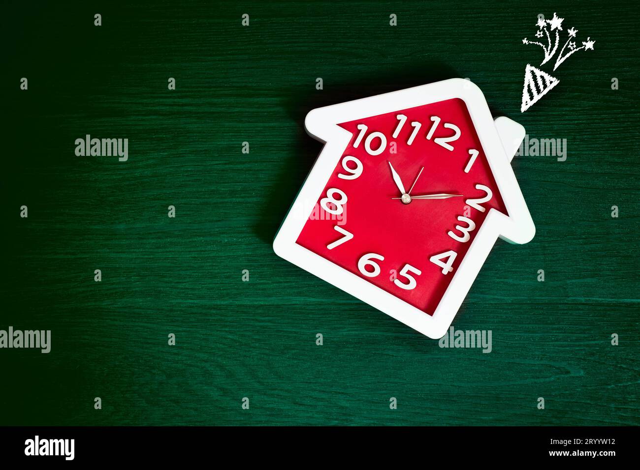 Home shape red clock on green floor background with celebration ...