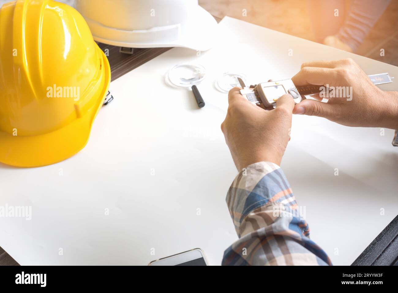 Construction engineer measuring with vernier caliper. Business and ...