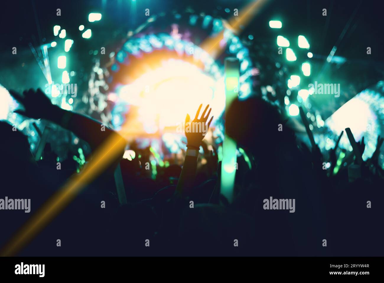 Rock concert with silhouettes people in happy gesture and raising up ...