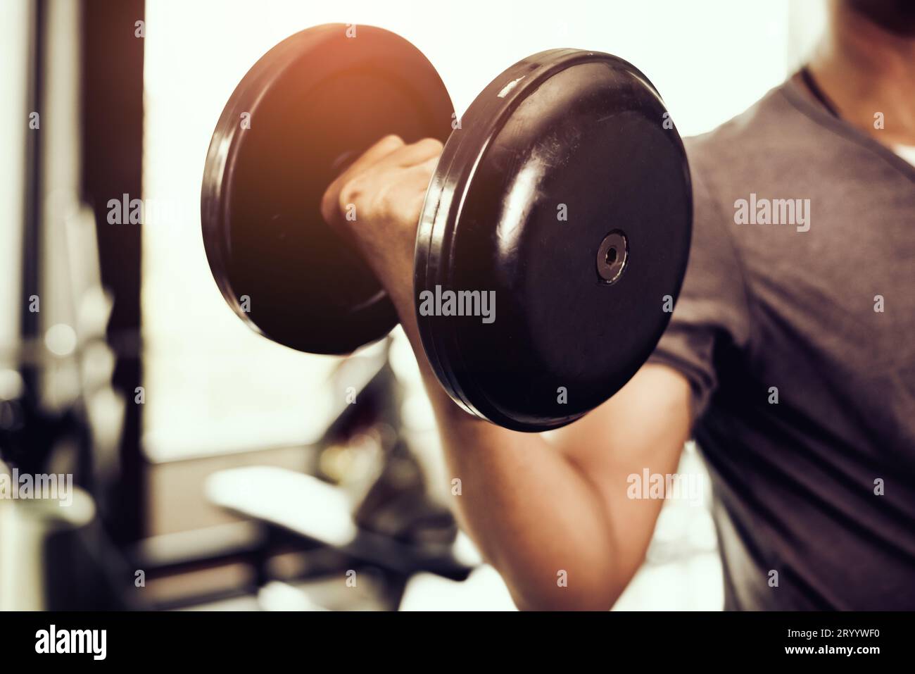 Closeup of dumbbell. young man lifting heavy weights. Sport equipment ...
