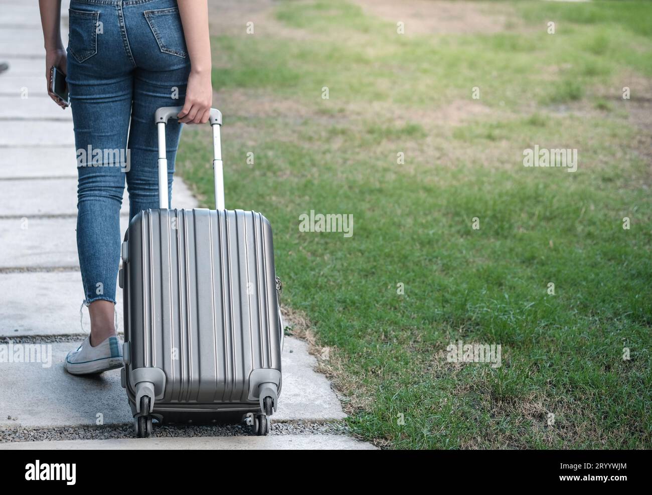 Traveler woman carrying luggage. Tourist walking with Suitcases Travel ...