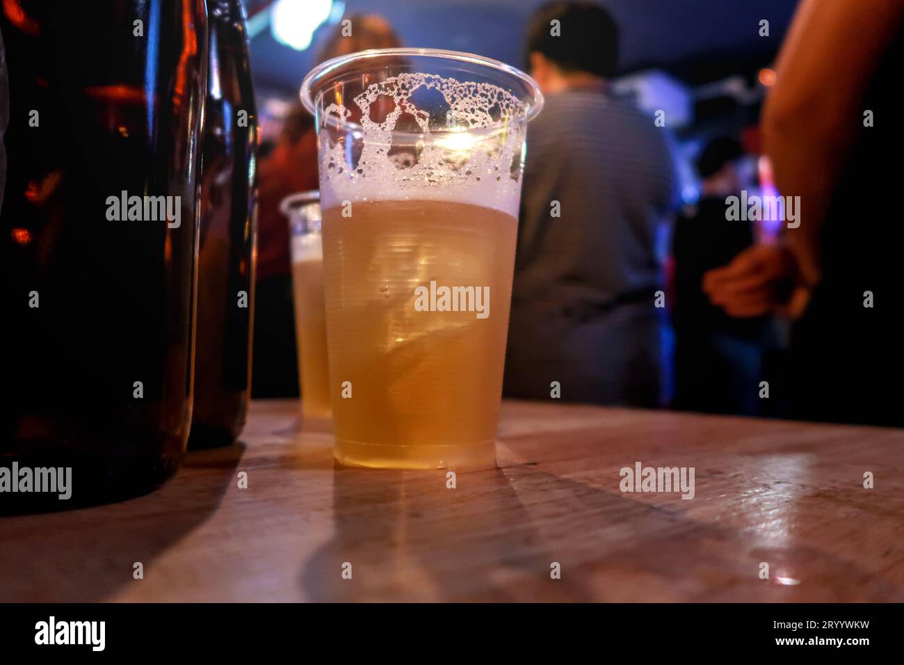 Draft beer. Enjoying Evening Drinks at the pub party in a nightclub ...