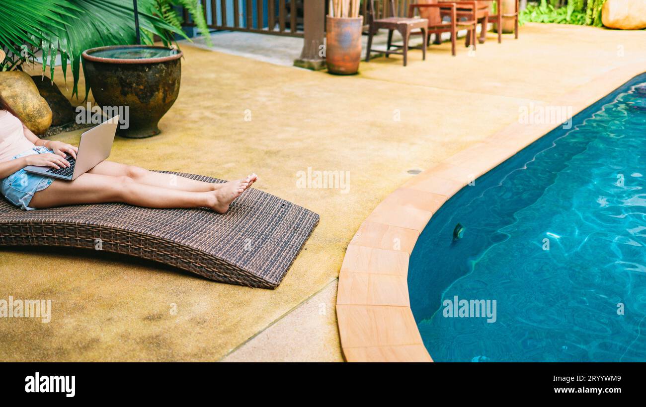 Vacation Woman working on her laptop in holiday remote online working ...