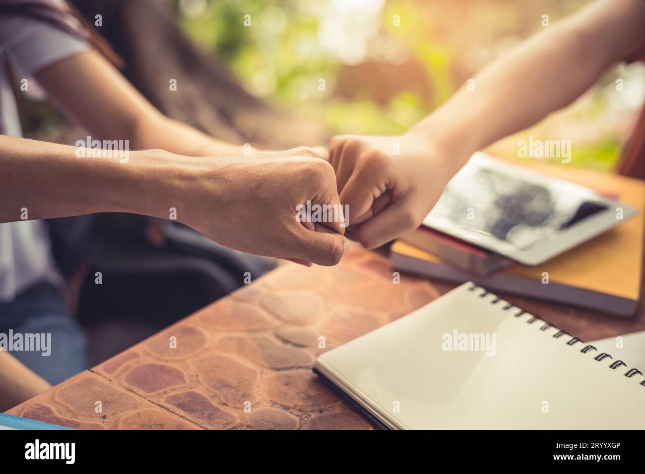 Business partnership giving fist bump to Start up new project. Business ...