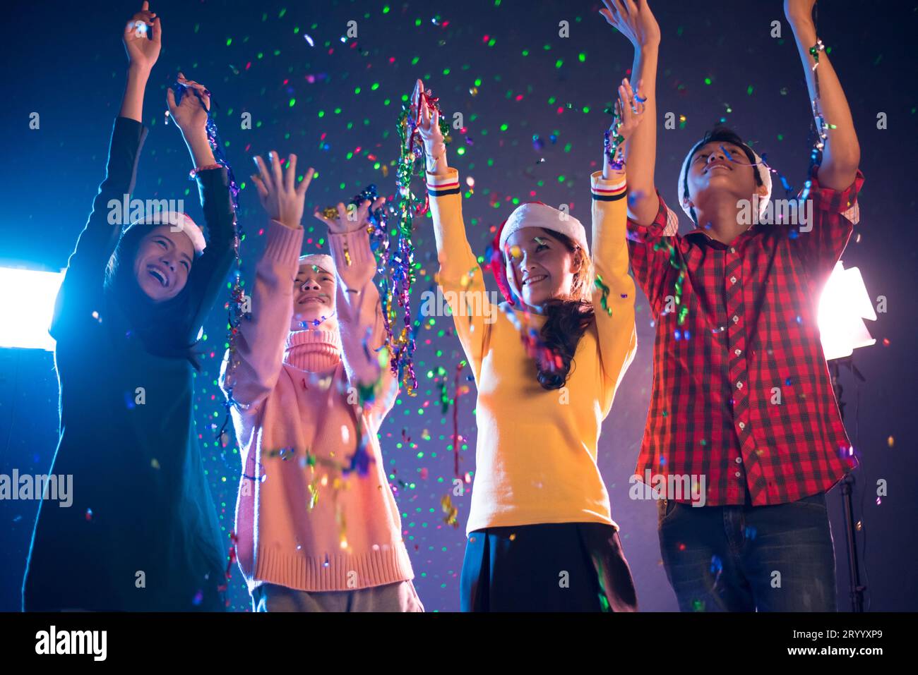 Group of Asian people celebrating New year party in night club with ...