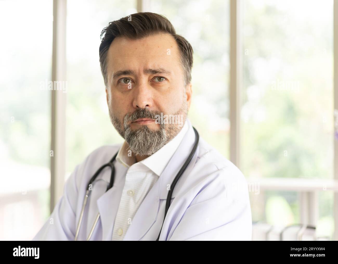Caucasian physician portrait. Doctor with stethoscope portrait in ...