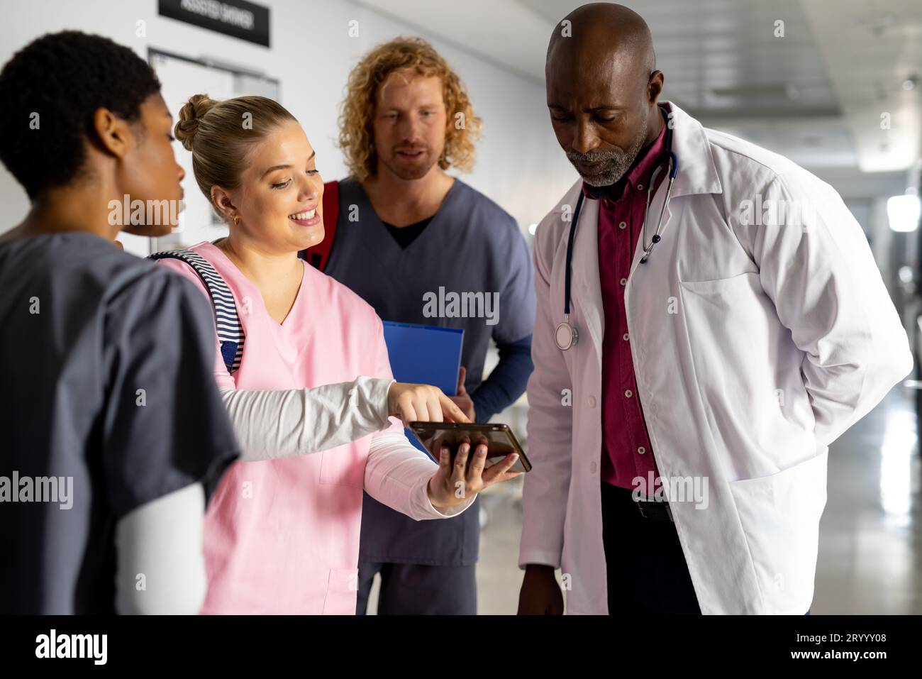 Senior african american male doctor talking to diverse trainee doctors ...