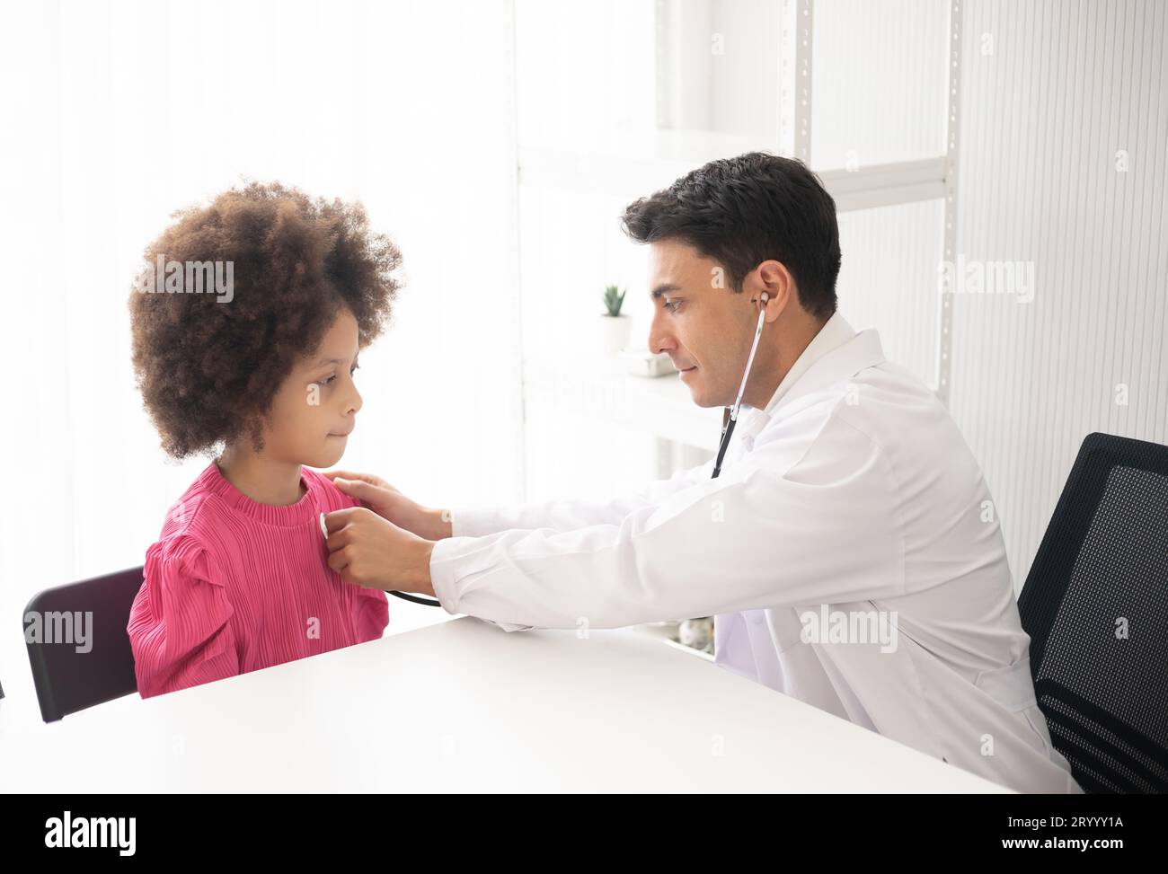 Hispanic physician meeting and diagnosis mixed-race afro children with ...