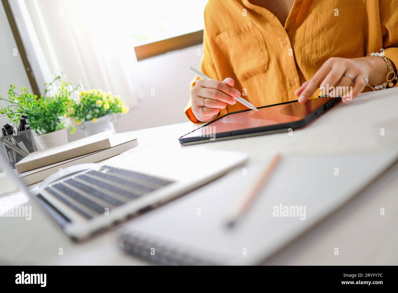 Young female designer artist drawing graphic for new design on tablet ...