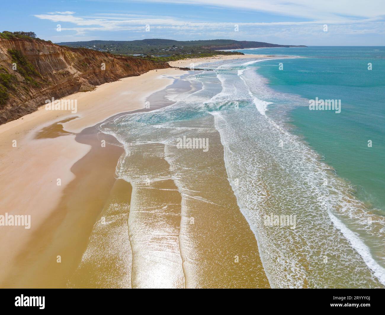 Aerial view of waves overlapping below cliffs along the g Great ocean ...