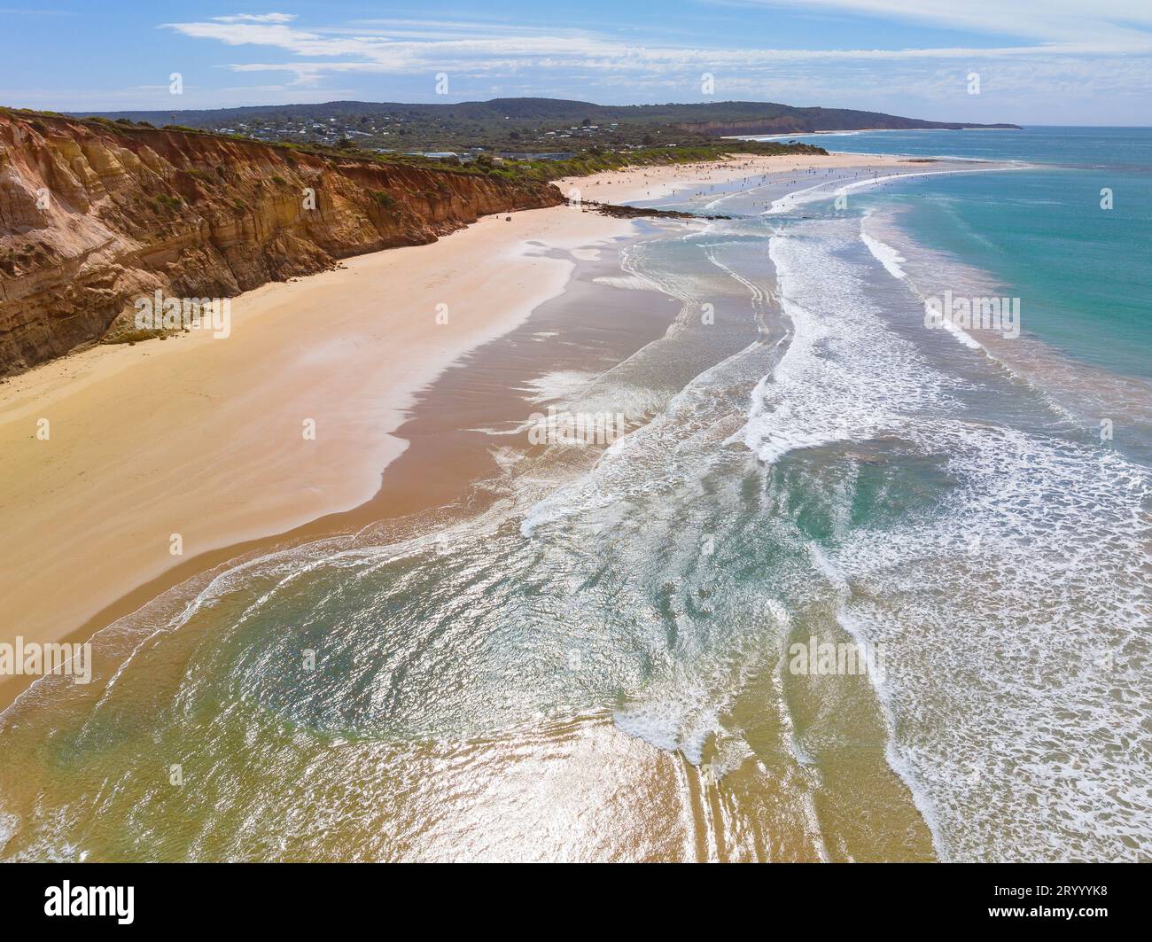 Aerial view of waves overlapping below cliffs along the g Great ocean ...