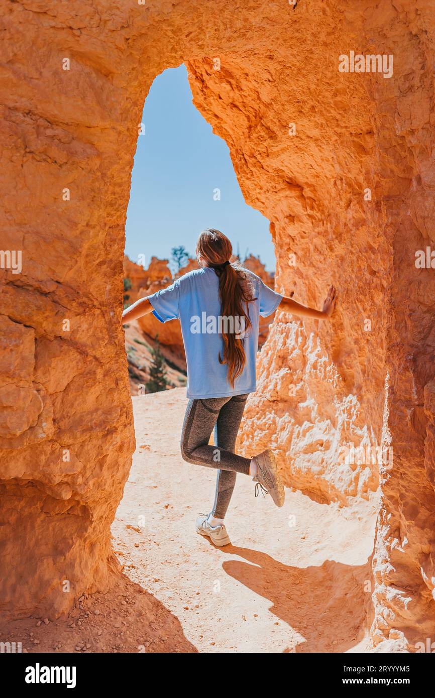 Hiker Girl In Bryce Canyon Hiking Relaxing Looking At Amazing View During Hike On Summer Travel