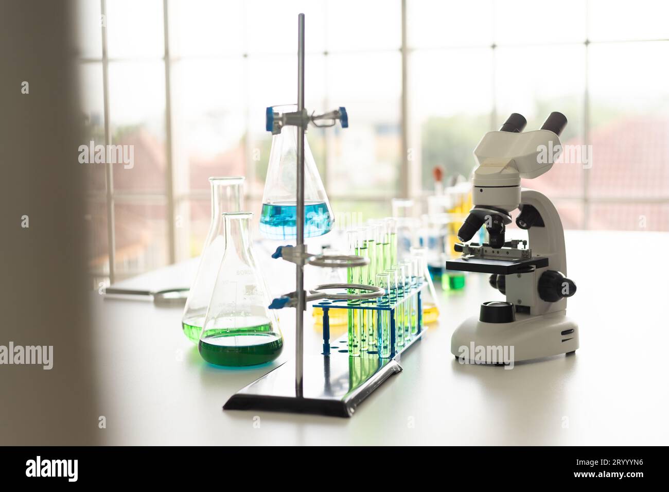 Science equipment in the laboratory. Beaker, test tube, microscope ...