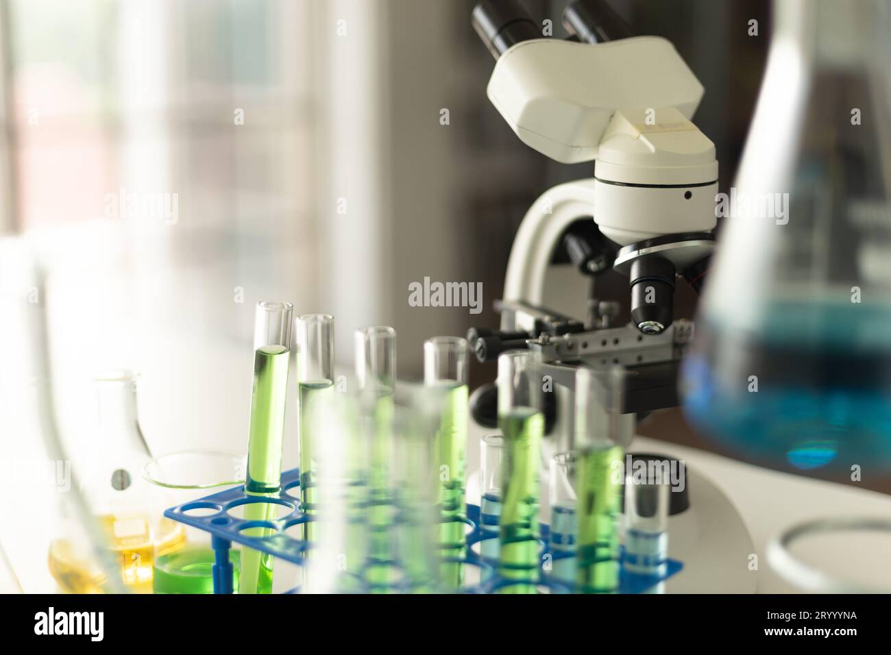 Science equipment in the laboratory. Beaker, test tube, microscope ...