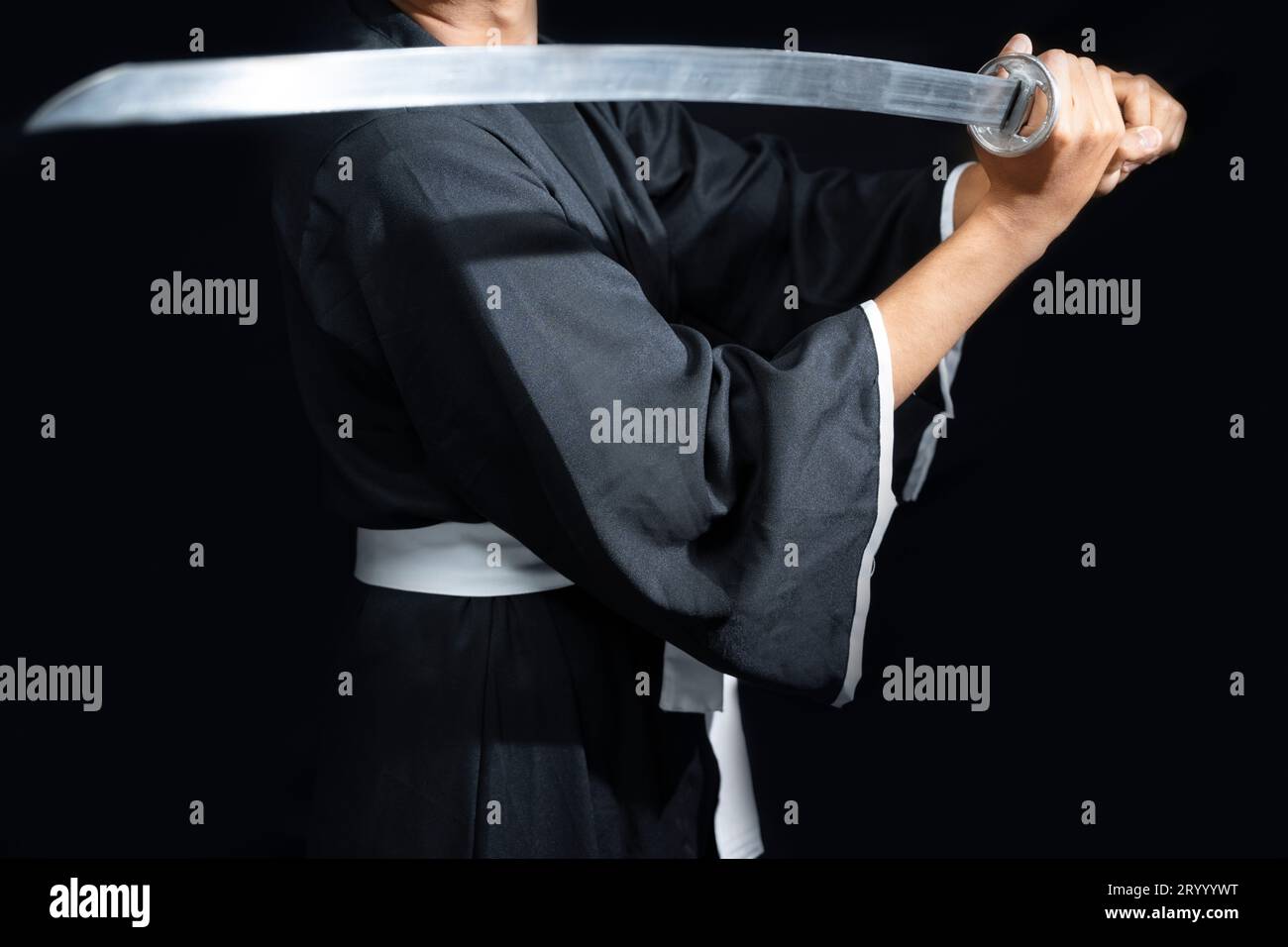 Young man holding samurai sword hi-res stock photography and images - Alamy