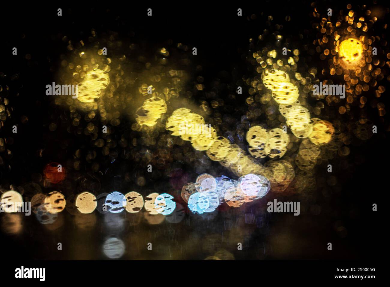 melted background on the front fogged car window in the rain in the ...