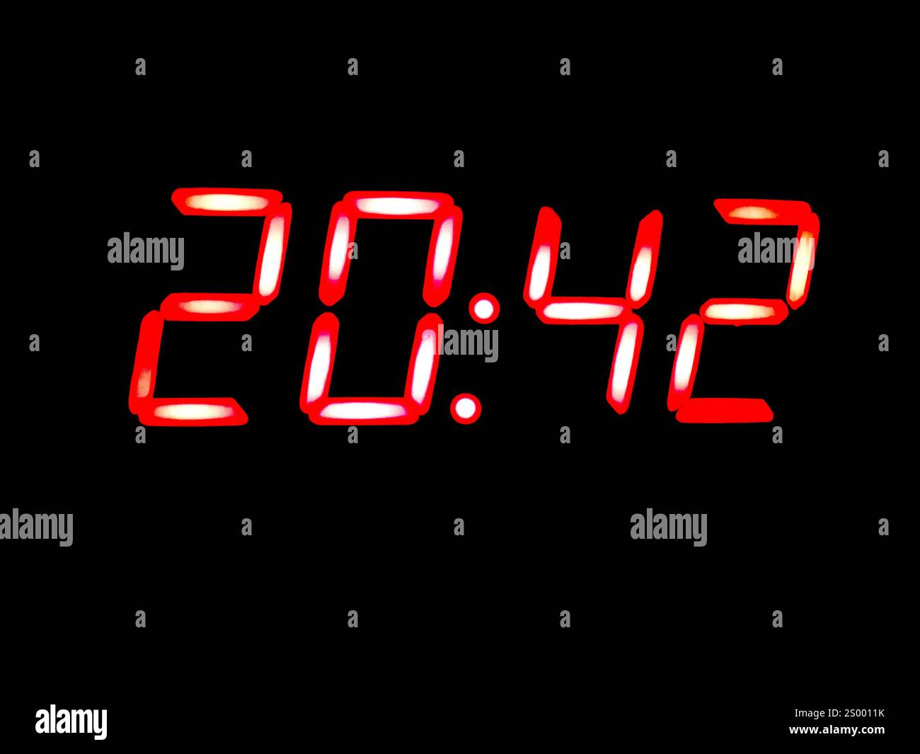 A digital clock face showing the time in red numbers on a black ...