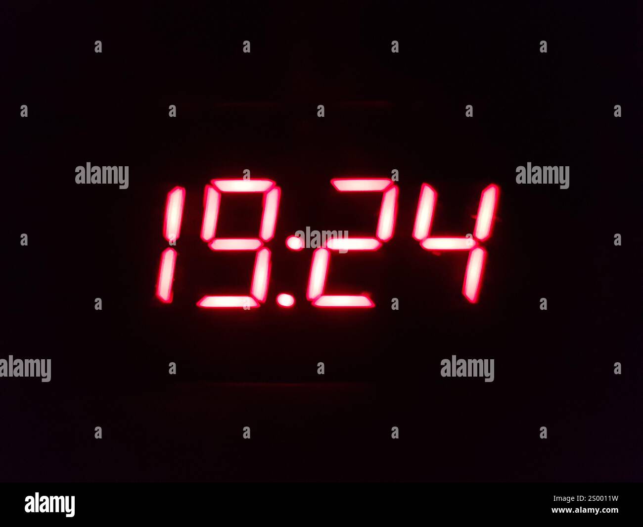 A digital clock face showing the time in white numbers on a black ...
