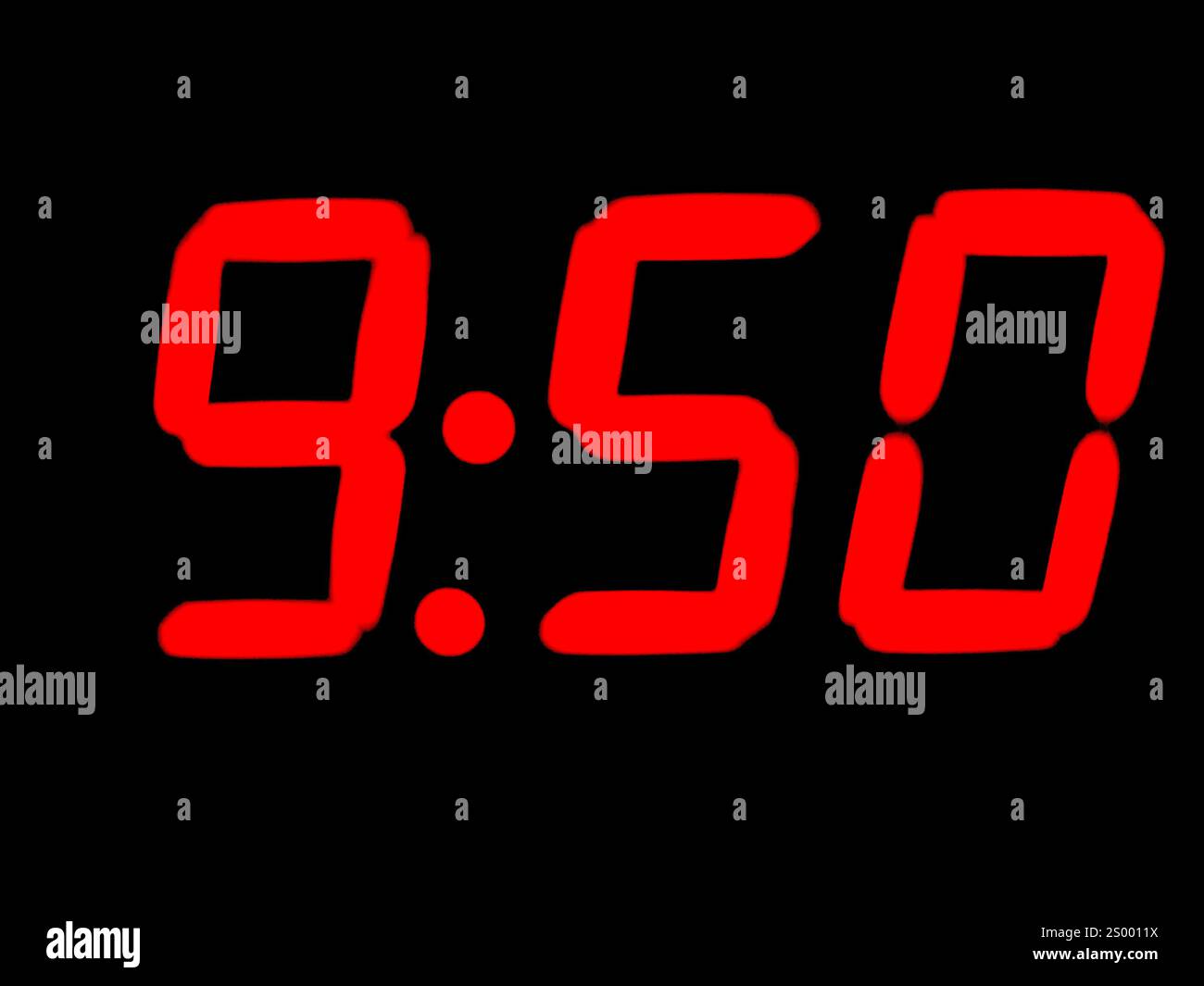 A digital clock face showing the time in red numbers on a black ...