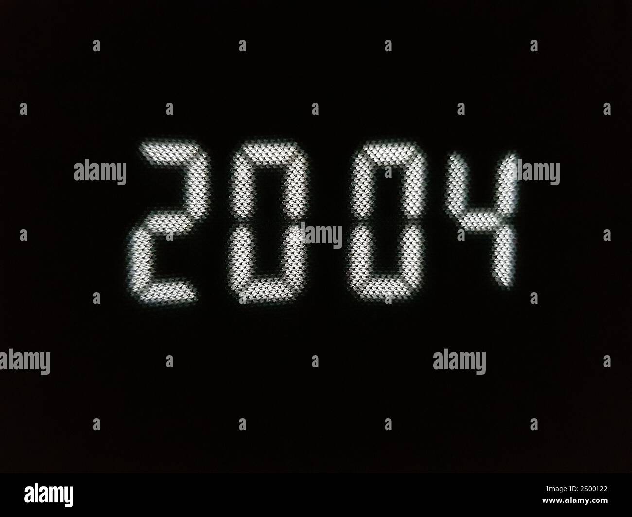 A digital clock face showing the time in white numbers on a black ...