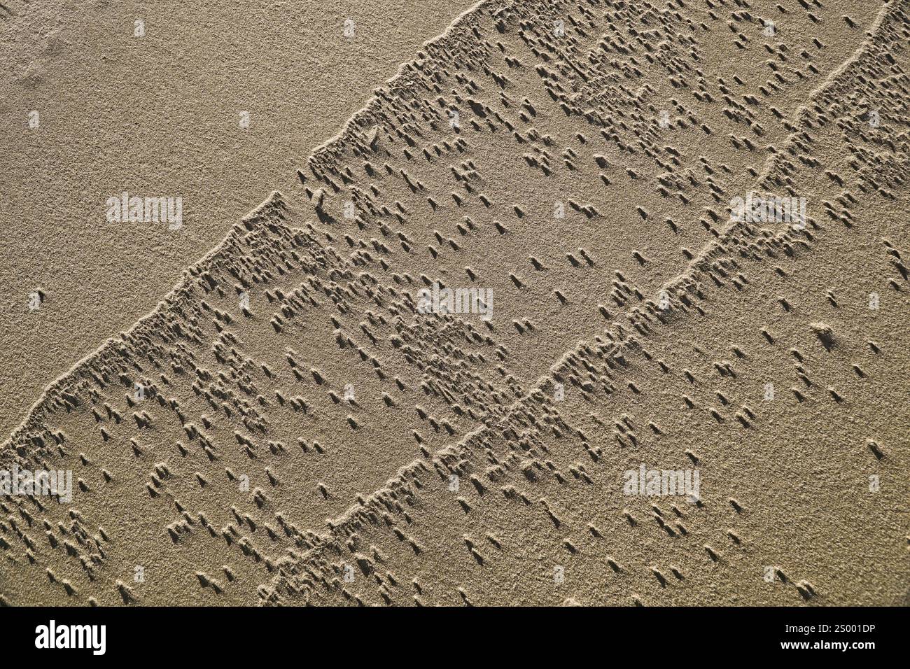 Unusual shapes and patterns in beach sand created by wave action Stock ...