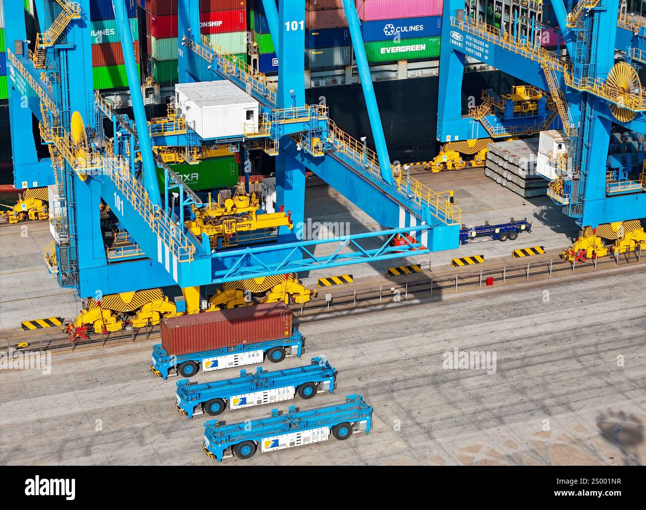 QINGDAO, CHINA - DECEMBER 23, 2024 - An automated guided vehicle delivers goods at a fully ...