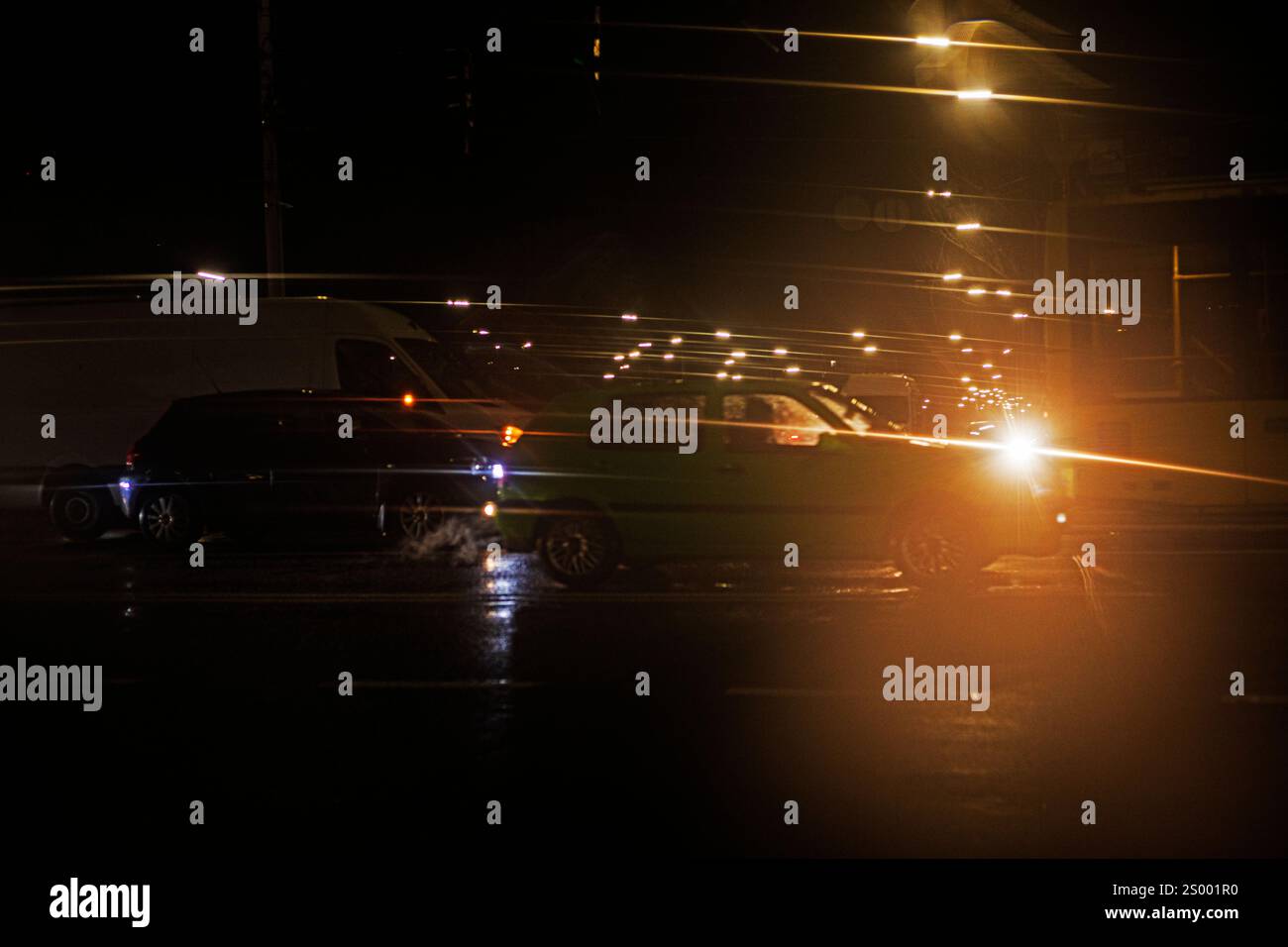 traffic jam at the intersection with a broken trolleybus late at night ...