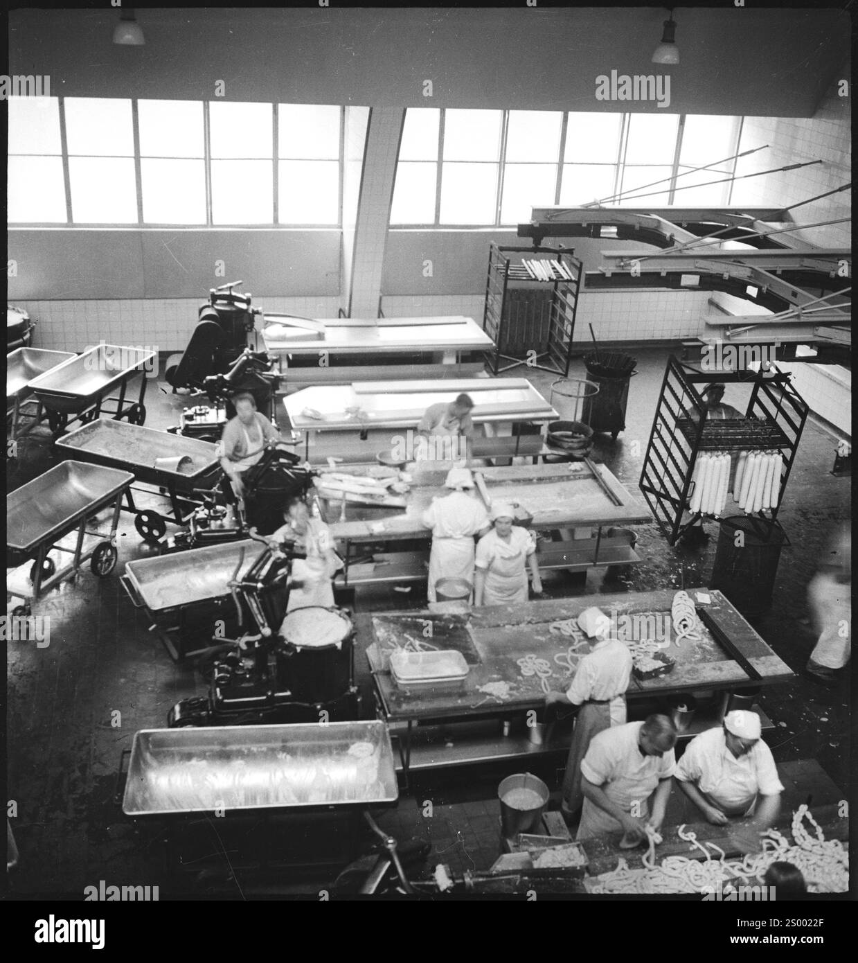 Factory; factory hall and workers preparing sausages in United States ...