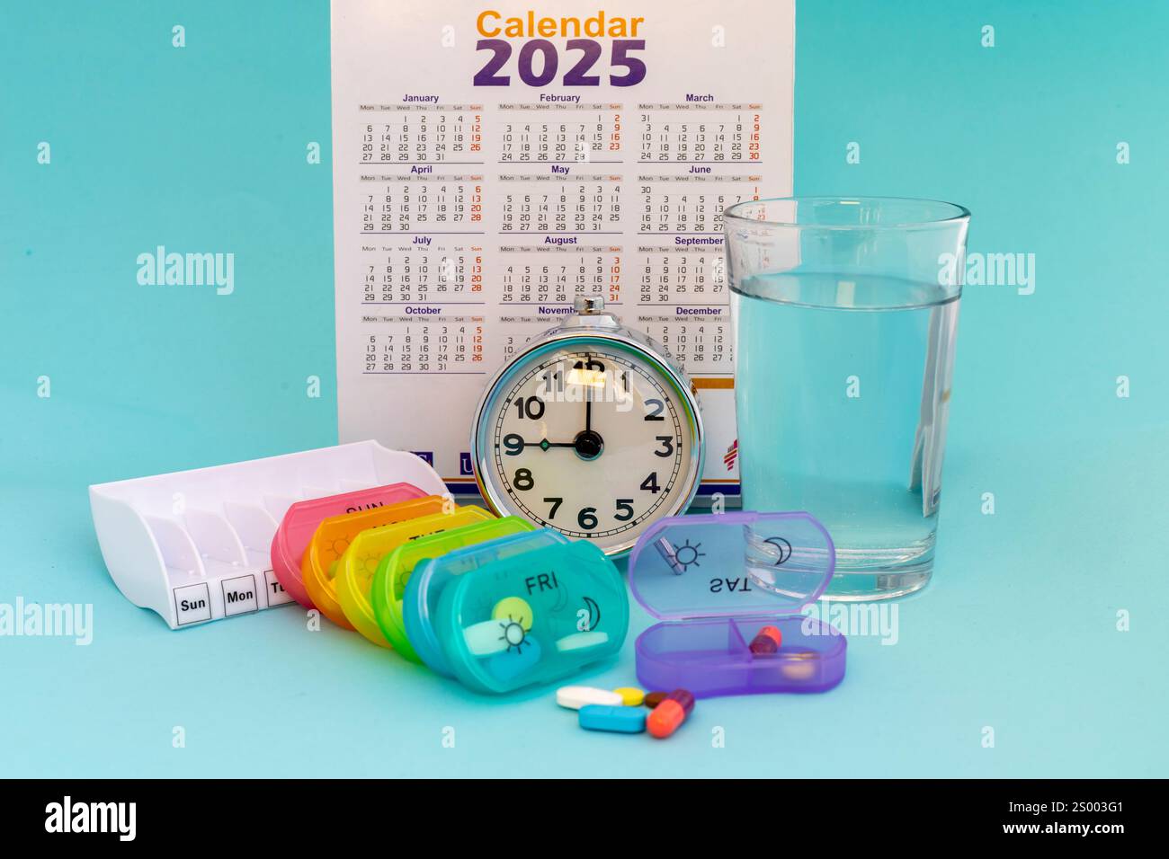 New year 2025 health care goal. Calendar, alarm clock and medicine on ...