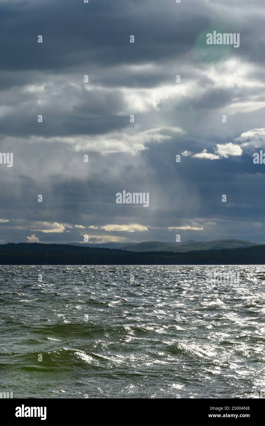 A mix of sun and clouds in the skies over Lake Winnipesaukee, the ...
