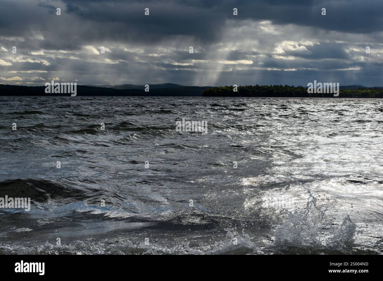A mix of sun and clouds in the skies over Lake Winnipesaukee, the ...